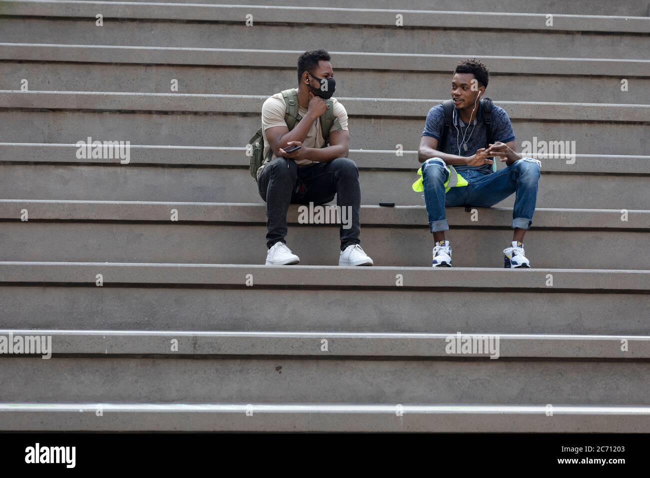 Two men talking on steps downtown Boston Massachusetts USA Stock Photo ...