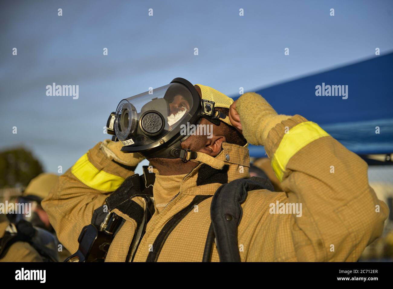 San Diego, United States. 13th July, 2020. A U.S. Navy Sailor puts on ...