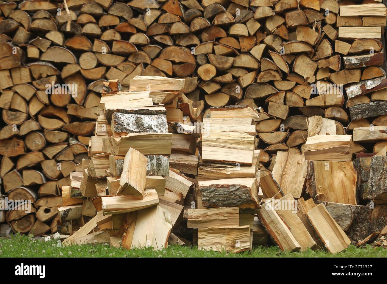 Pile of firewood. Preparation of firewood for the winter at an old farm ...