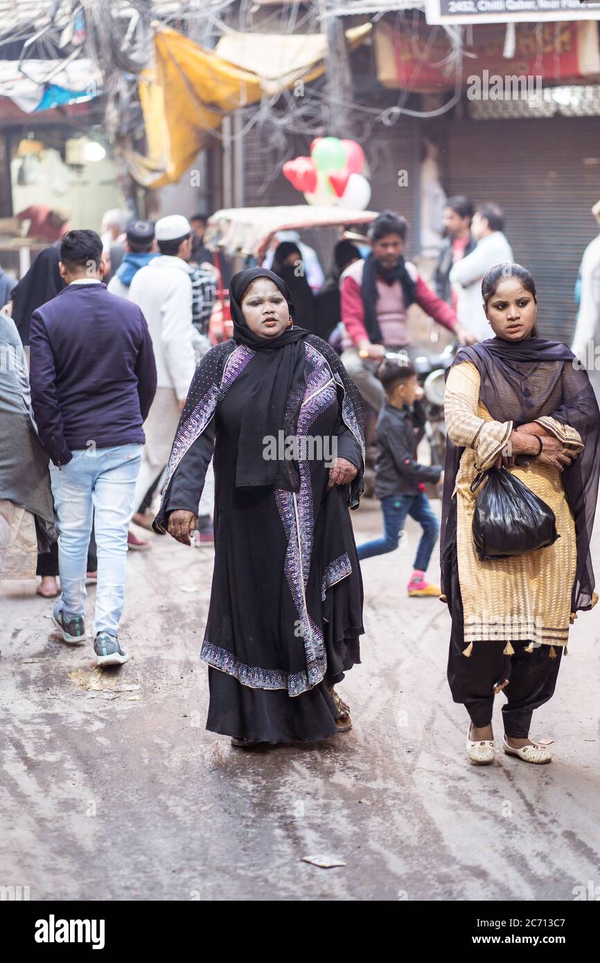 New Delhi / India - February 18, 2020: Muslim people walking down alley ...