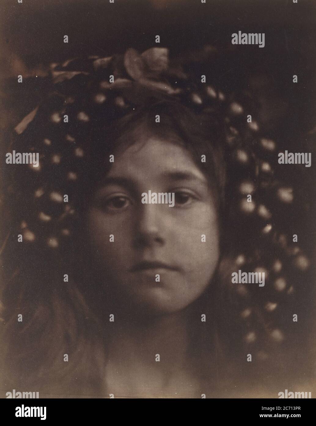 Circe, 1865. A child (Kate Keown) with grapes and leaves around her ...