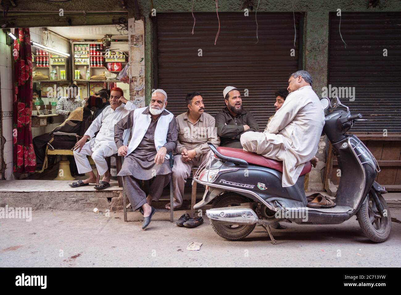 New Delhi / India - February 18, 2020: group of Musim men sitting ...