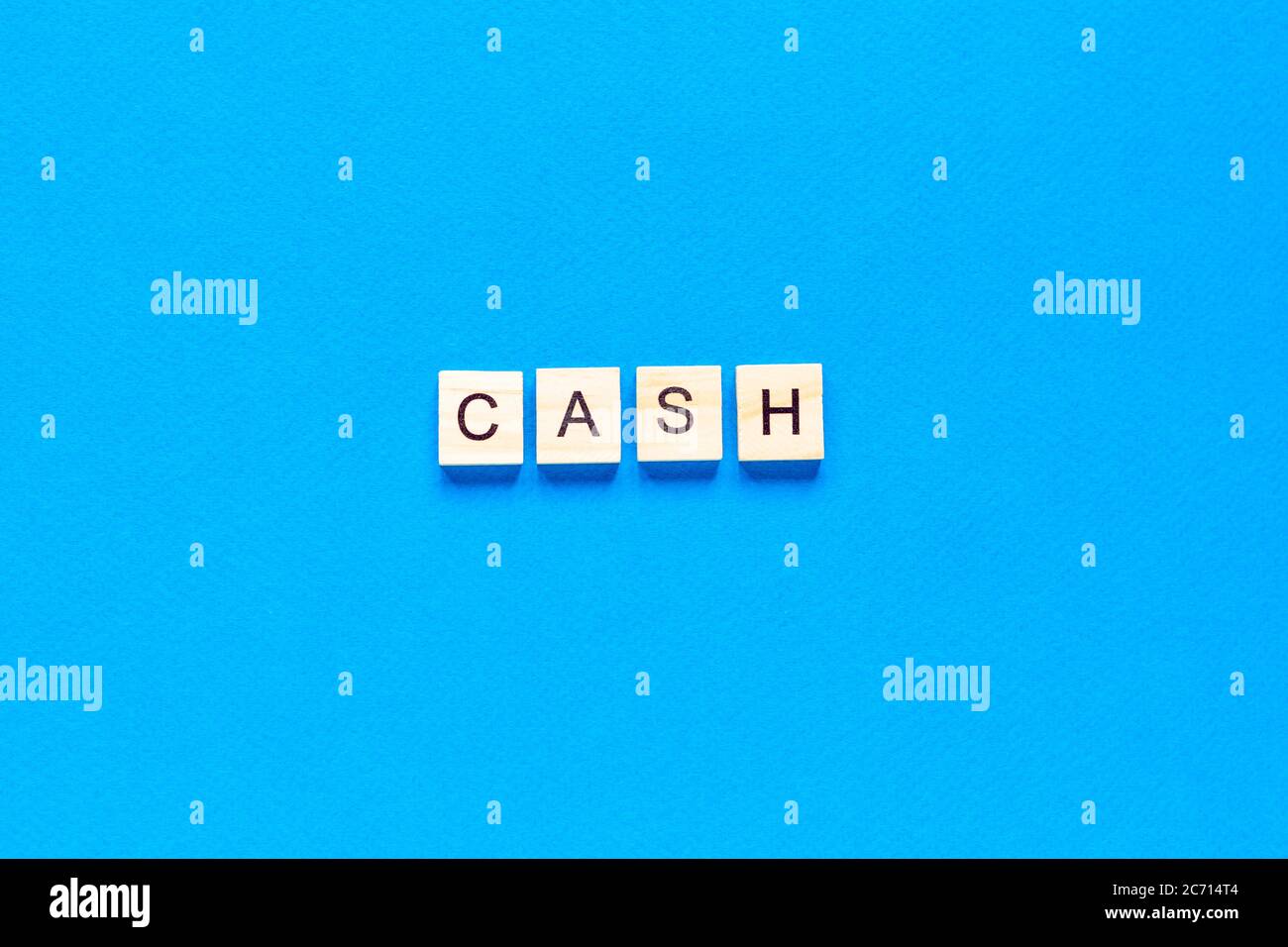 cash inscription in wooden letters on a blue background, flat layout ...