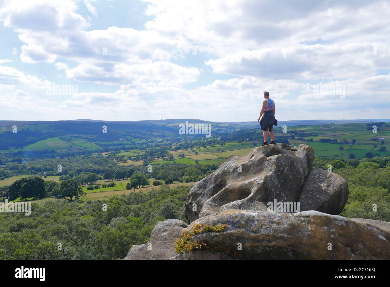 A tourist takes in the sights of the Yorkshire Dales from one of many ...