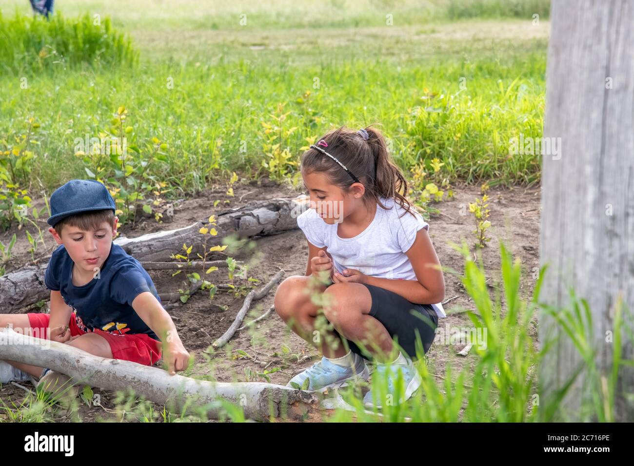 Two children playing outdoor in mountain landscape Stock Photo - Alamy