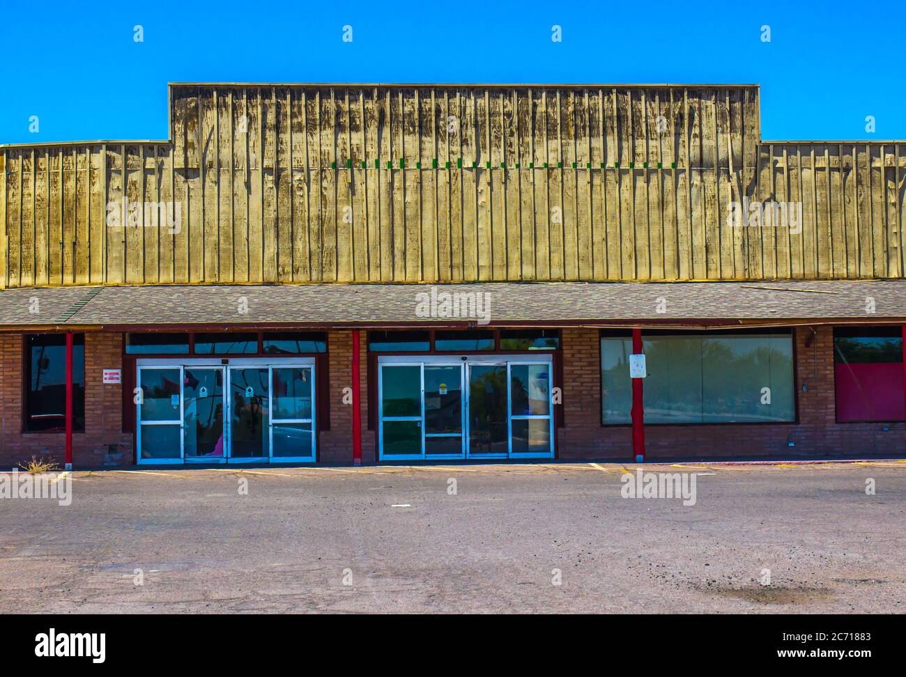 Old Retro Store Front Building With Blocked Out Windows Stock Photo - Alamy