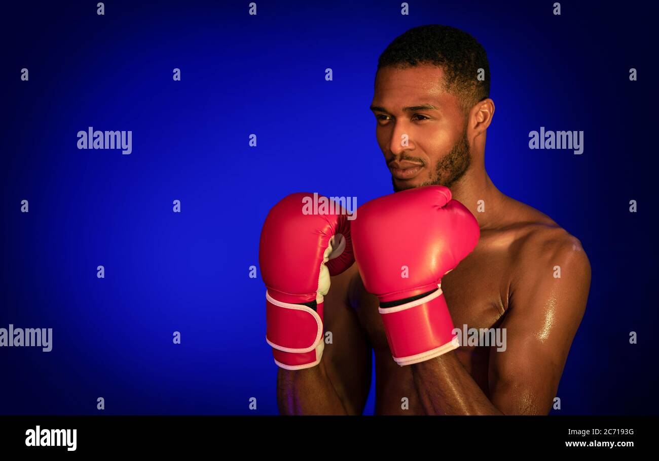 Shirtless Professional Boxer Standing In Ready-To-Fight Position On ...