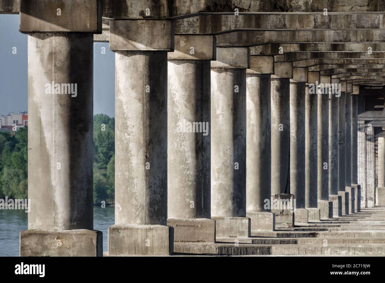 Old stone columns. Ancient colonnade. Corridor with columns Stock Photo ...