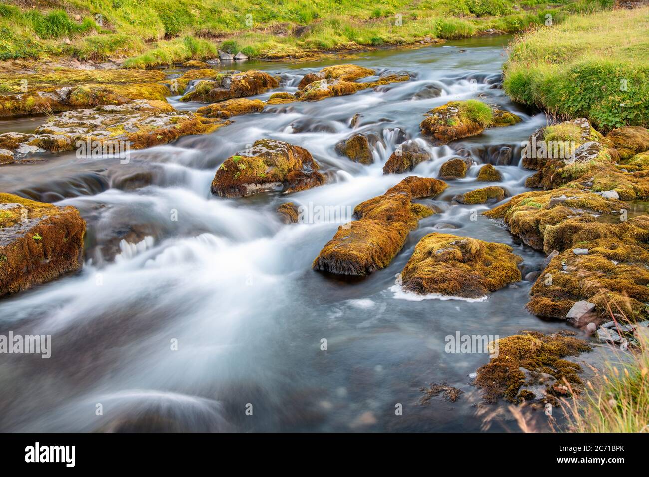 Beautiful waterfalls of Iceland at summer sunset, water flowing, long ...