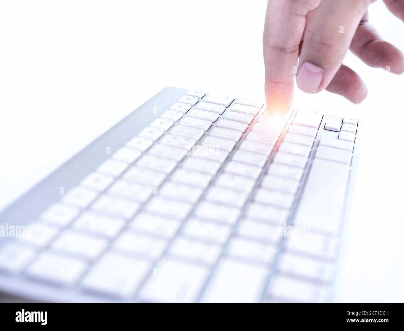 Finger pressing on enter button on remote control wireless computer ...