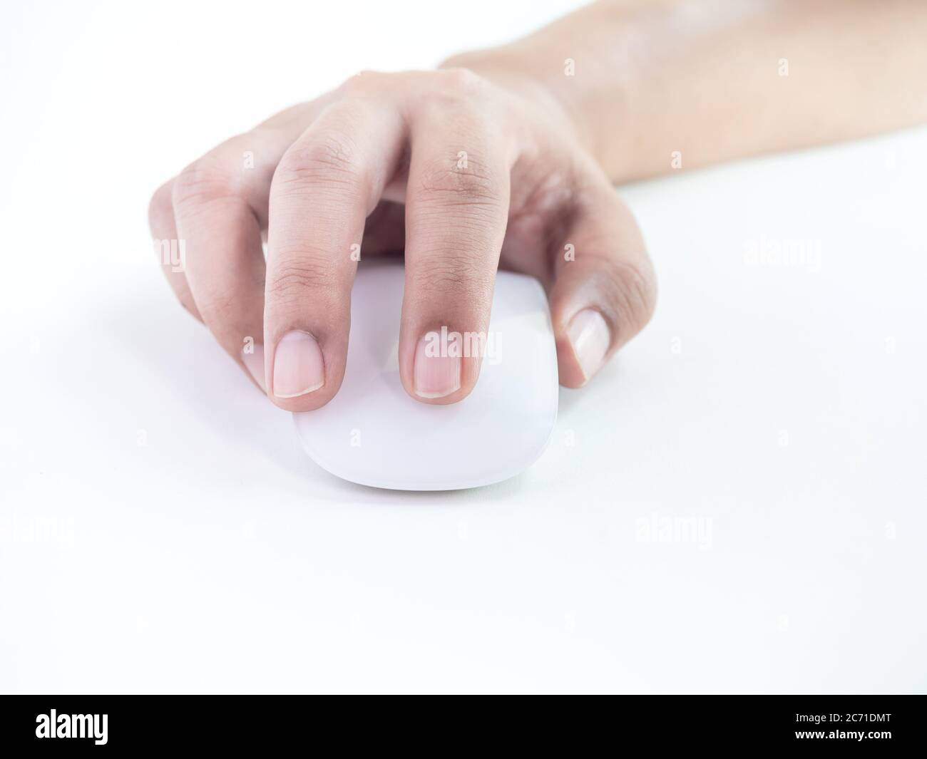 Hand using computer mouse. Close-up finger clicking on white modern ...