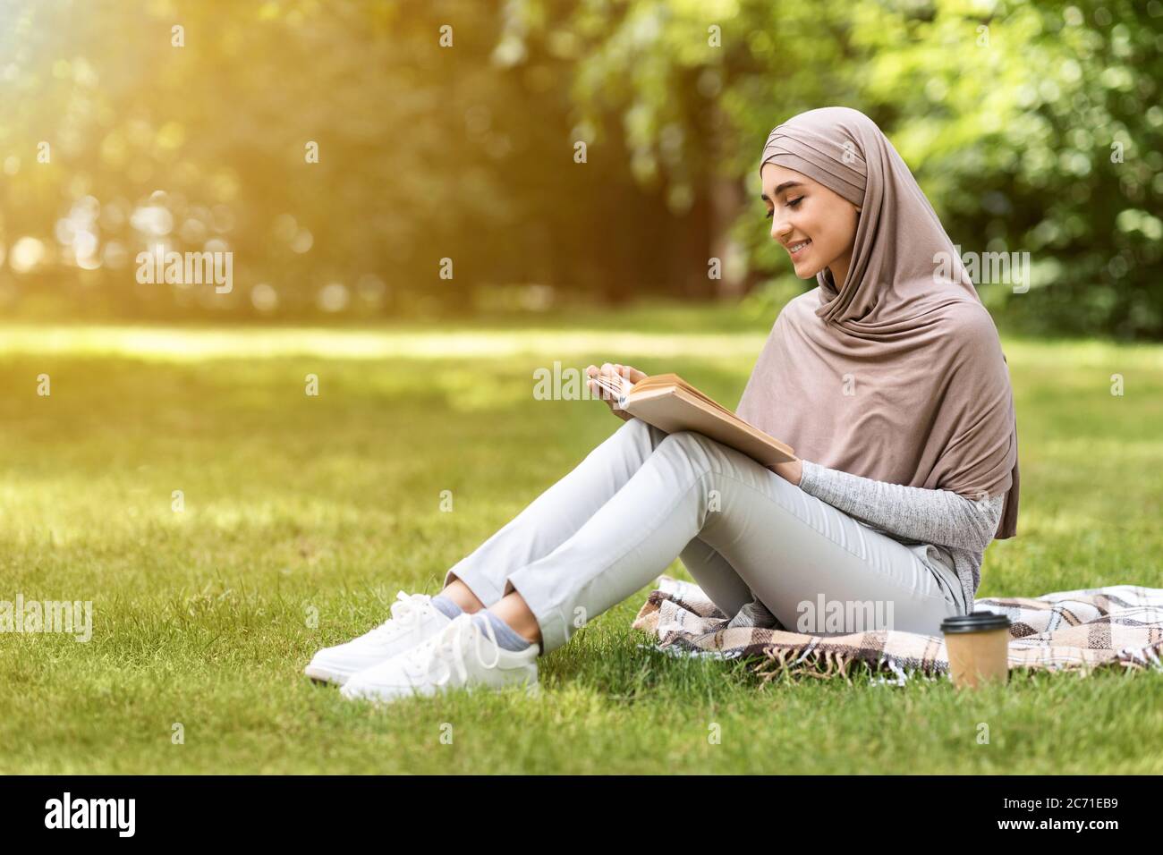 Relaxed muslim woman enjoying weekend at park Stock Photo - Alamy