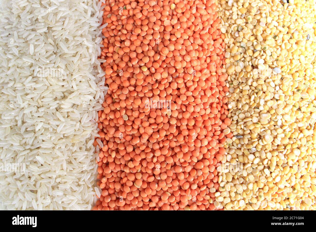 Pile of uncooked rice grain, red lentils and pigeon pea. Rice grains ...