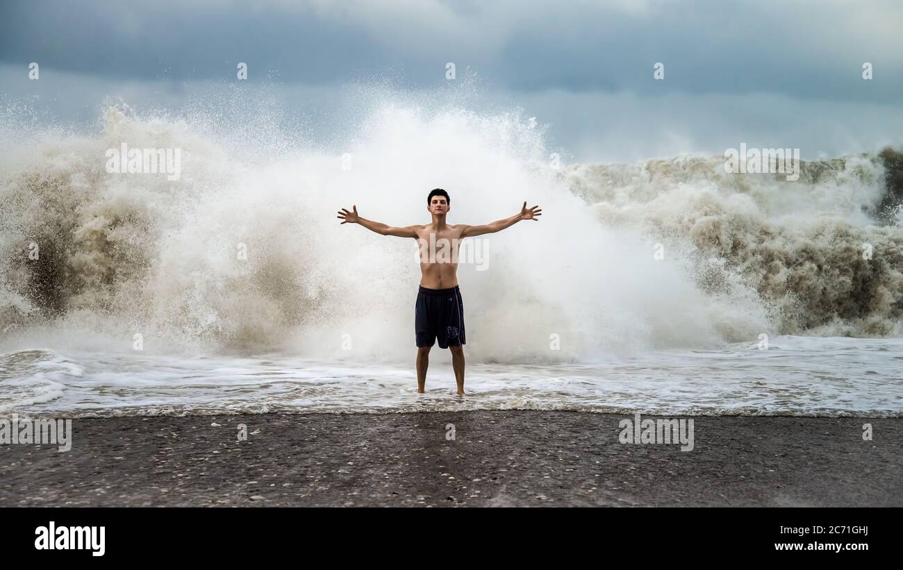 Antalya - Turkey - October 17, 2013: Young man standing against the sea ...