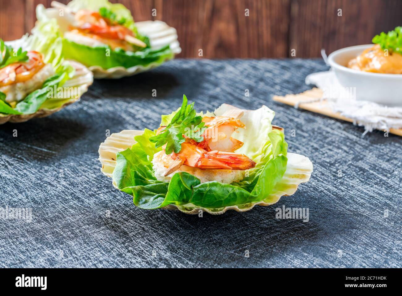 Canapes with grilled black tiger prawns and seafood sauce on fresh ...