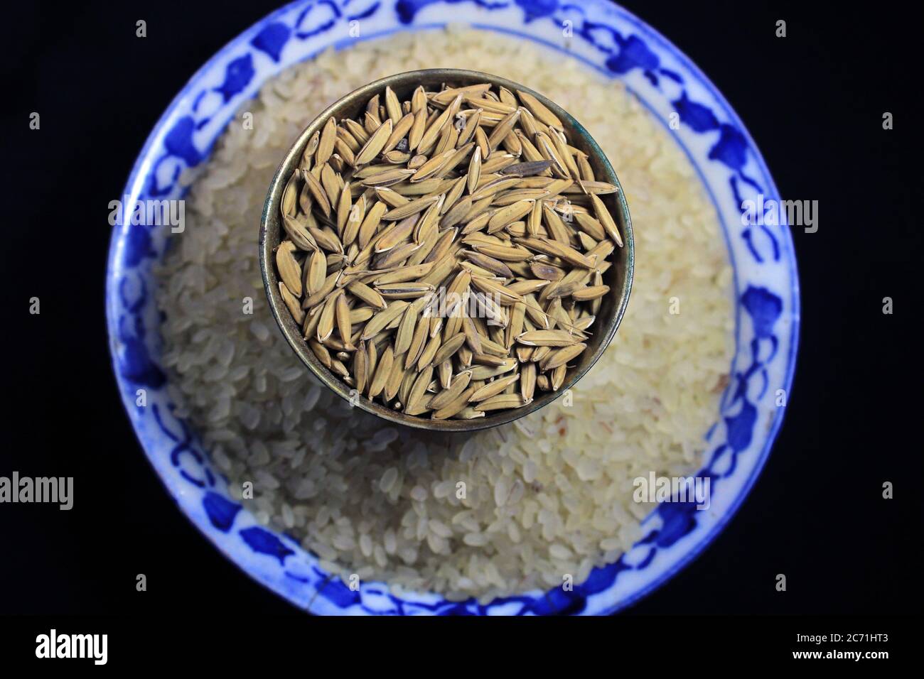 Rice grains in a bowl on white rice texture background. Macro ...
