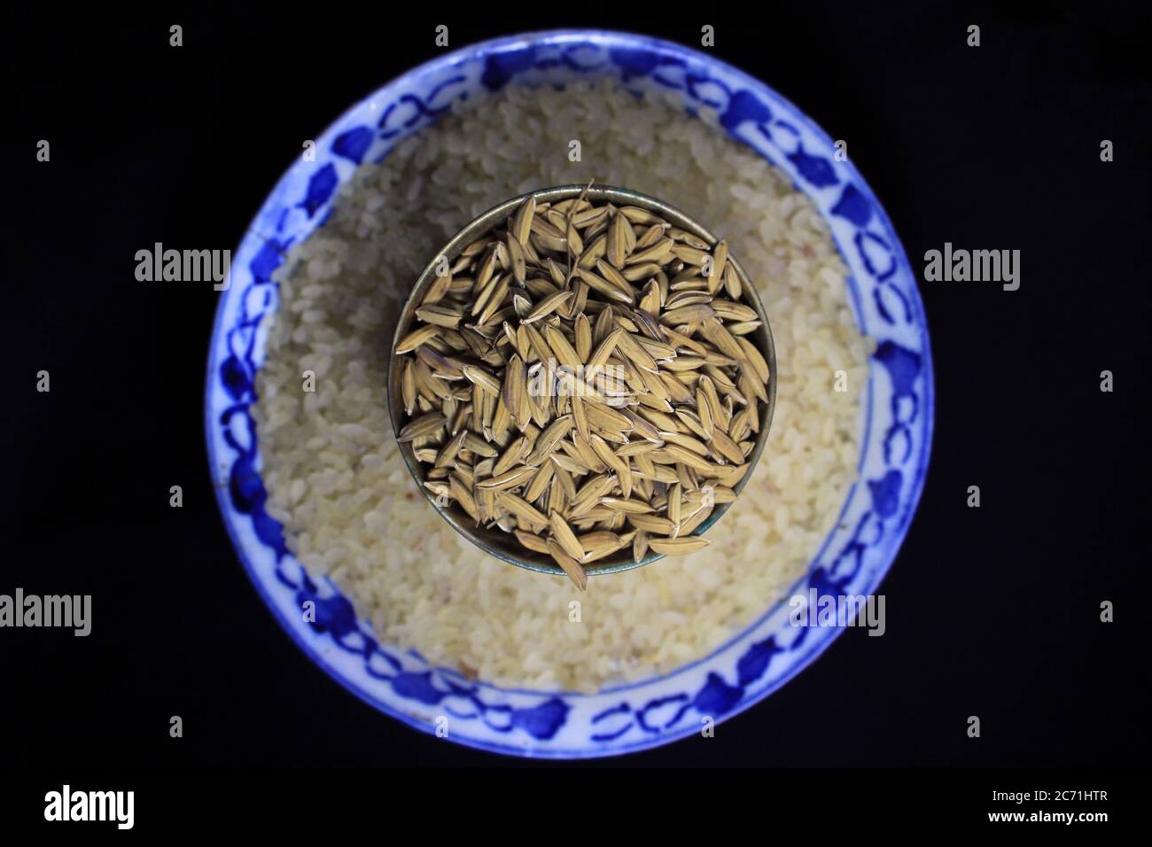 Rice grains in a bowl on white rice texture background. Macro ...
