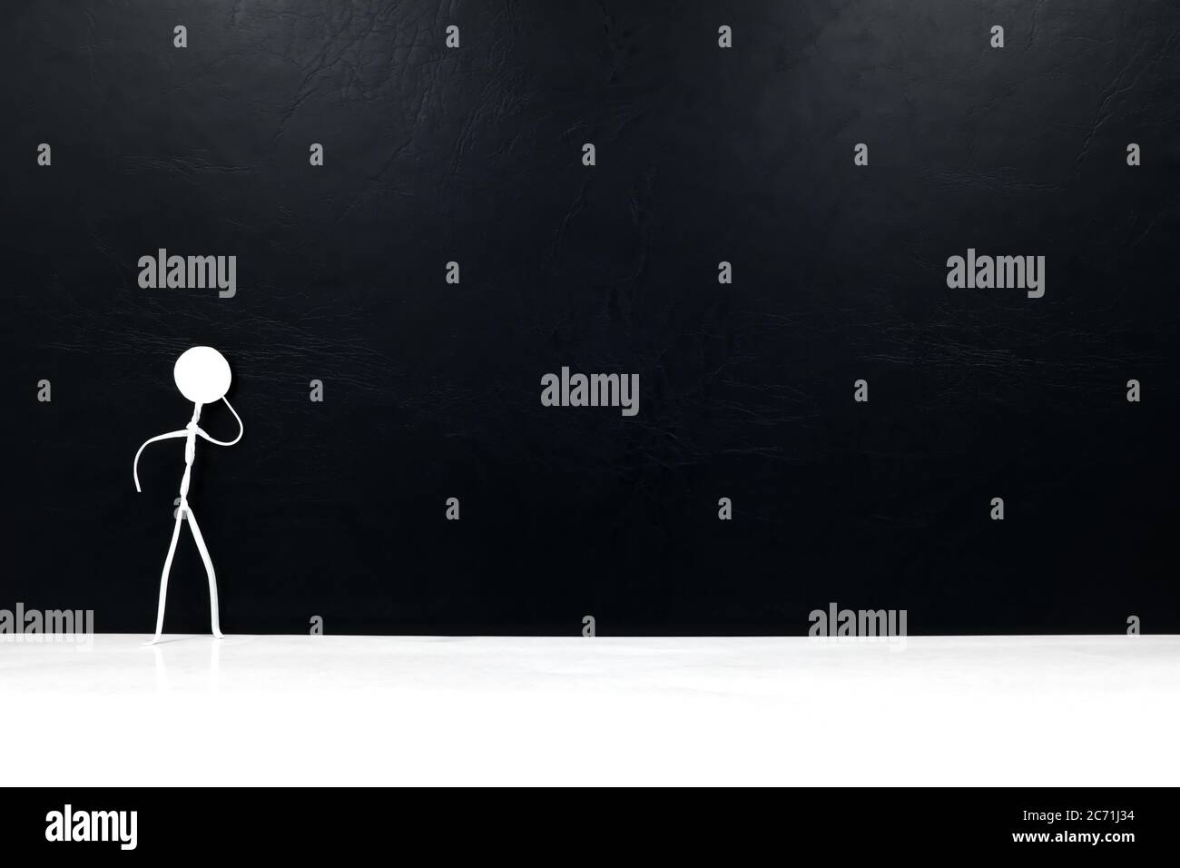 Human stick figure standing alone while thinking in black background ...