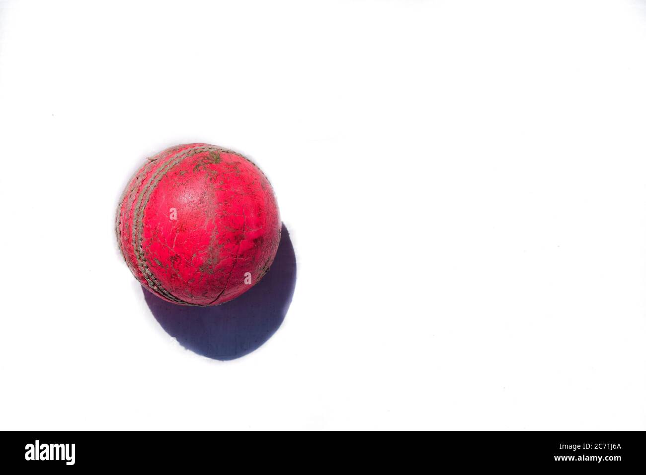 Pink cricket ball isolated on a white background Stock Photo - Alamy