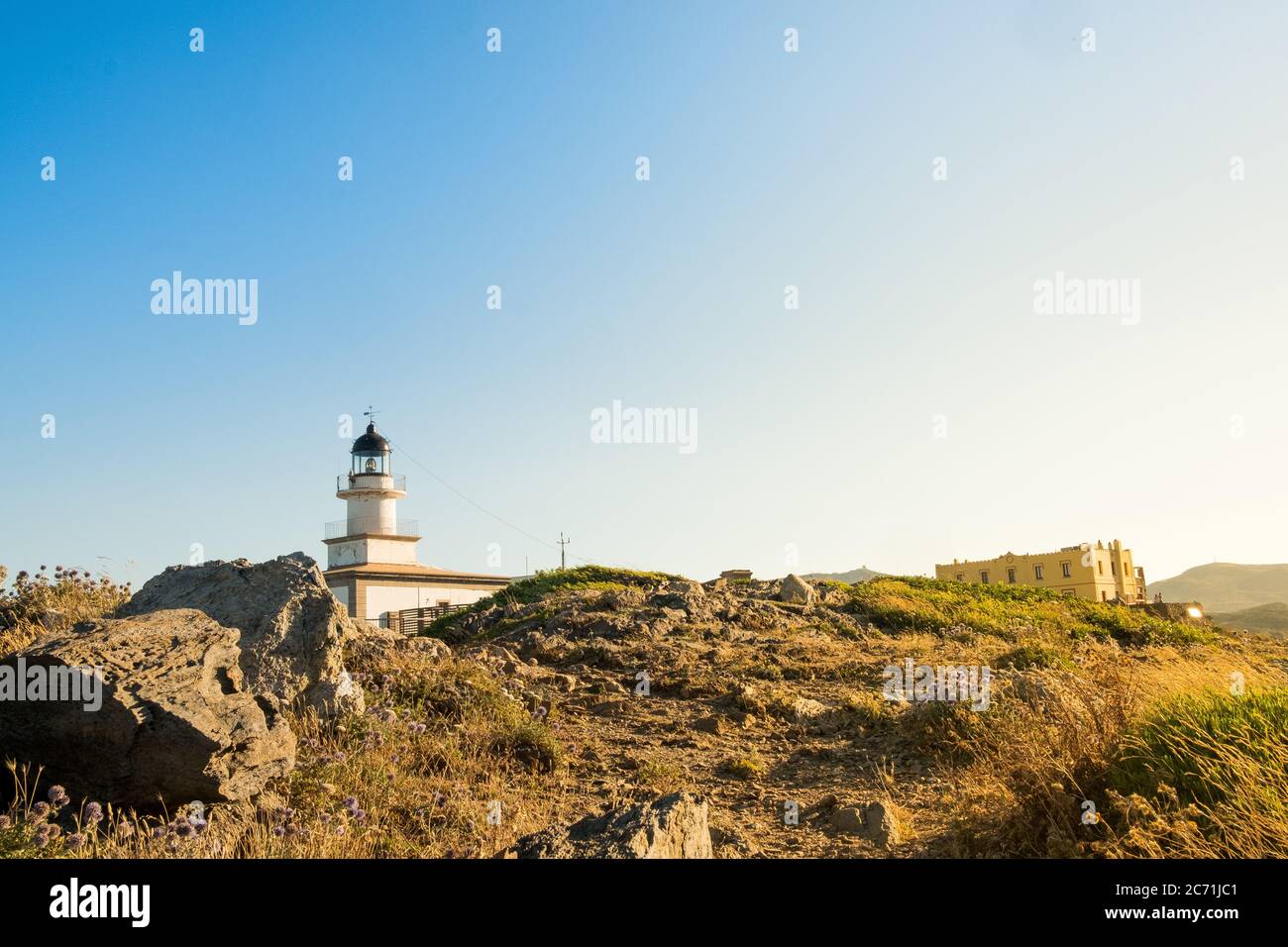 view of cap de creus lighthouse, a beacon of light on the rocky catalan ...