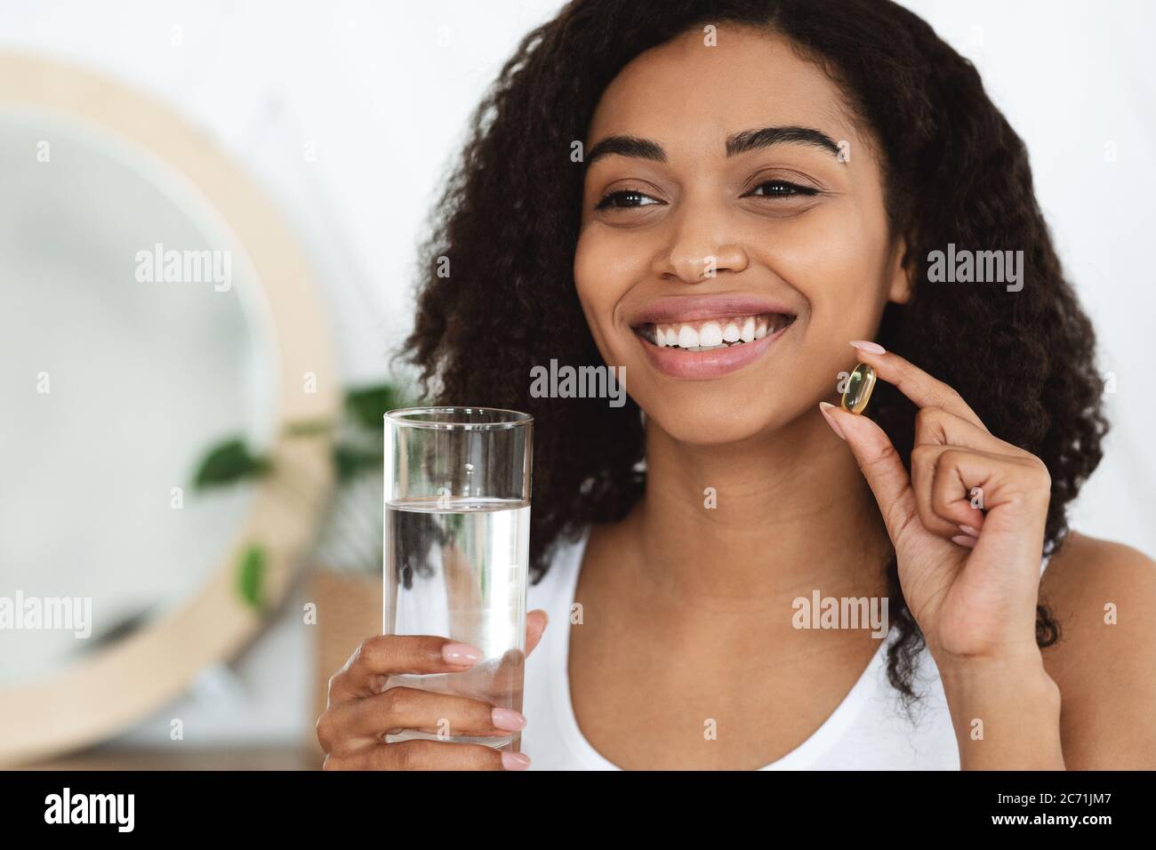 Daily Vitamins Intake. Happy Black Woman Holding Capsule Pill And Water ...