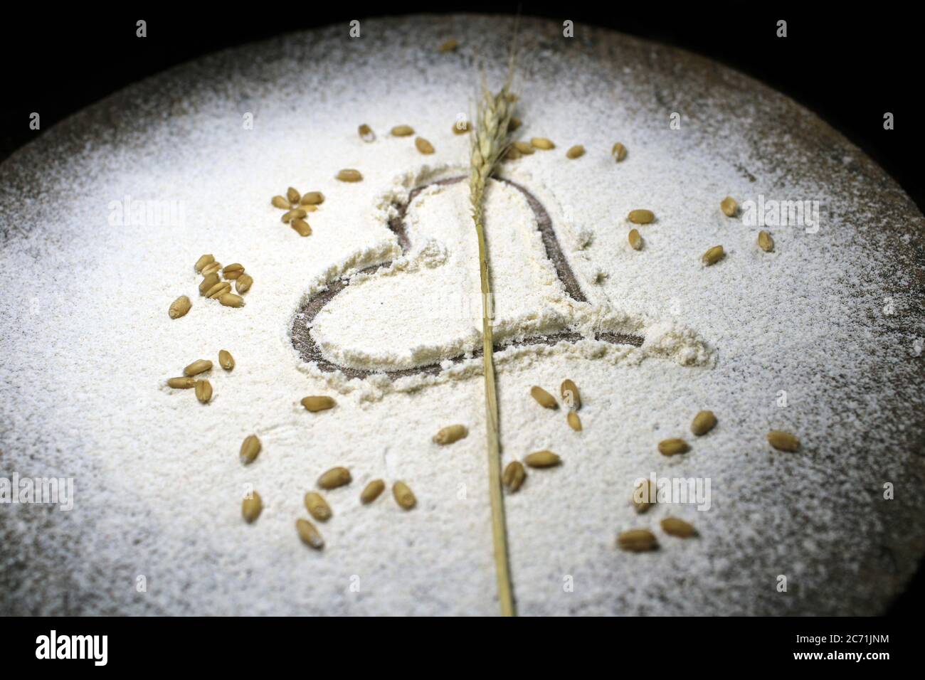 Heart shape in flour on baking board hi-res stock photography and ...