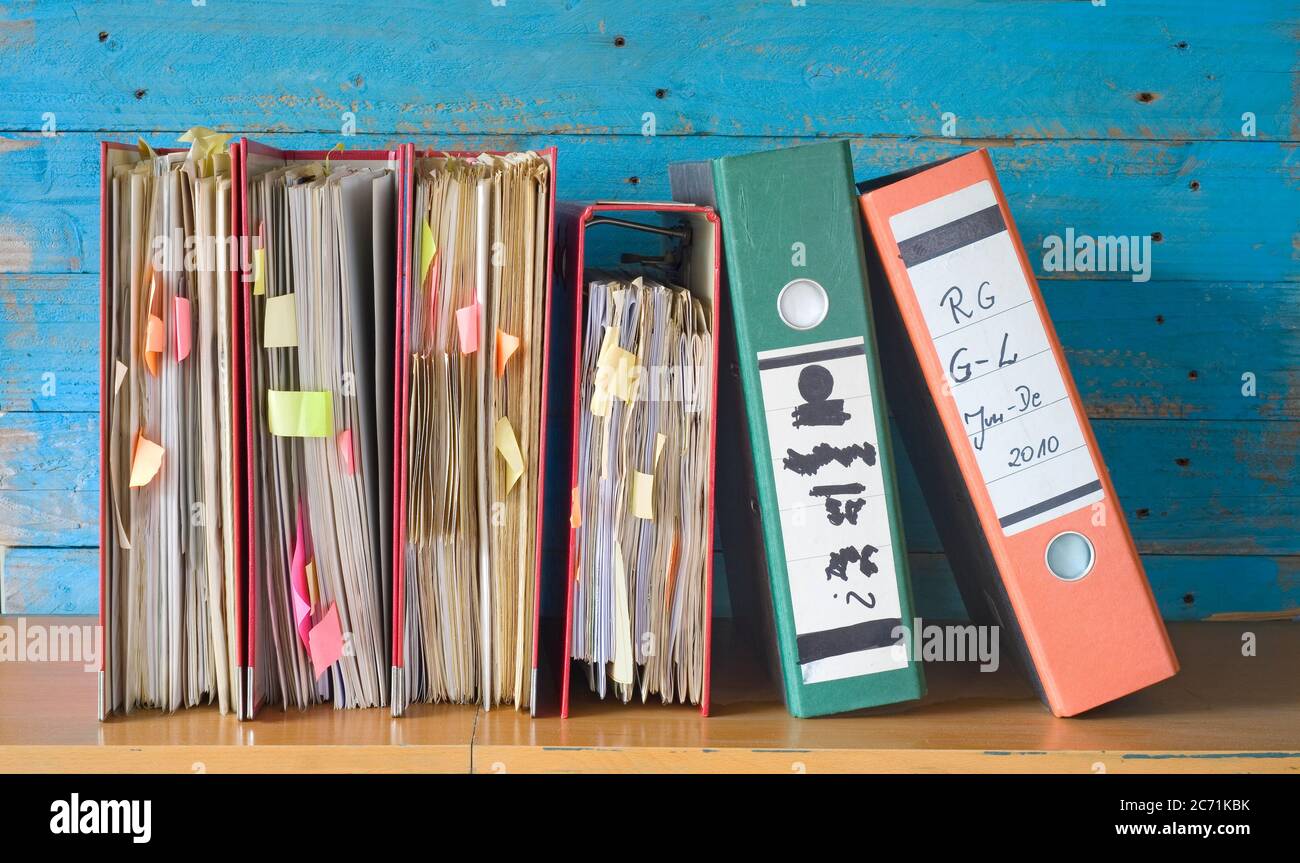 messy file folders and documents, bureaucracy and red tape concept ...