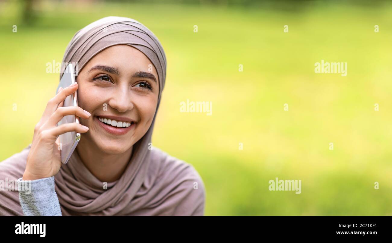 Closeup portrait of happy muslim girl talking on phone Stock Photo - Alamy