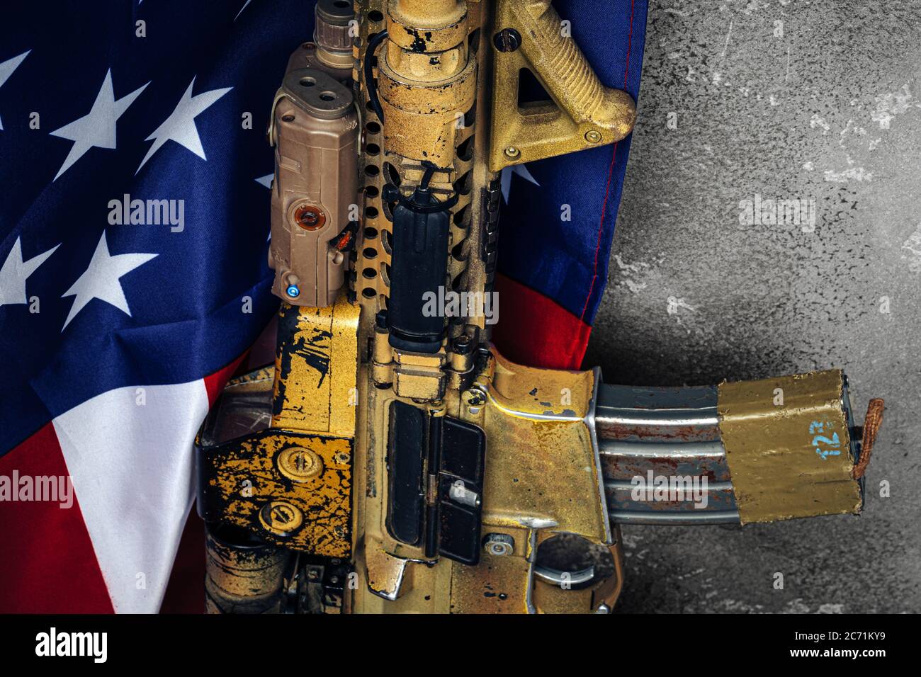 U.S. battle flag and assault rifle near the wall. close up Stock Photo ...