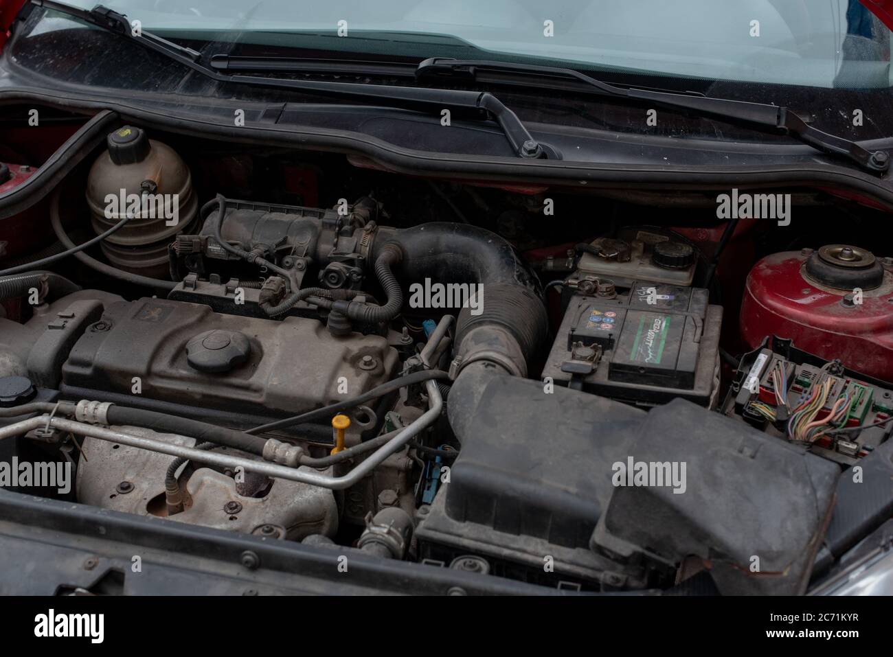 red car with opened hood. Red car hood open Stock Photo - Alamy