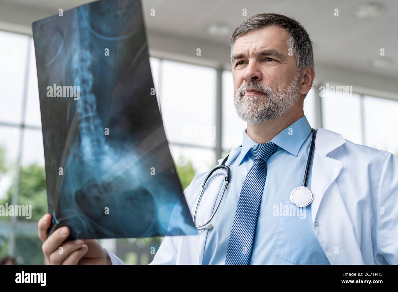 Doctor checking xray senior hi-res stock photography and images - Alamy
