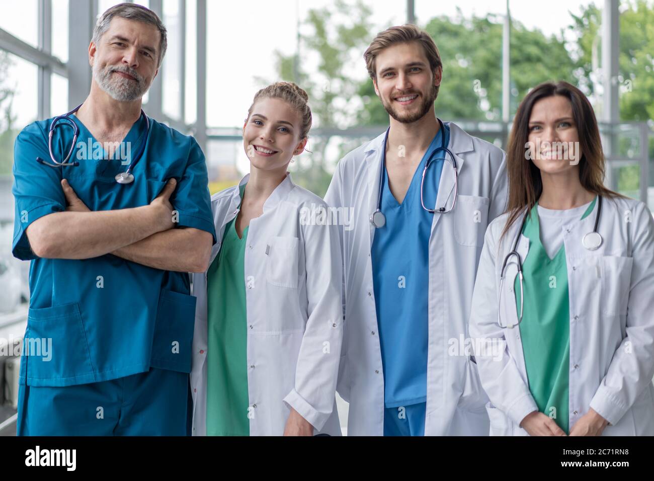 Group of medical staff smiling at the hospital Stock Photo - Alamy