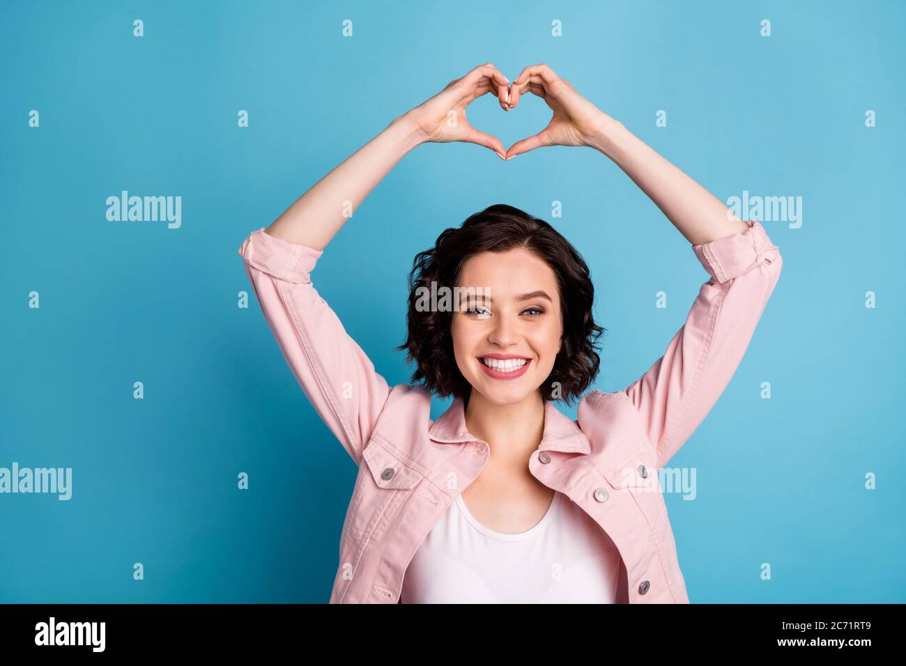 Photo of beautiful cheerful lady short black hairdo hold arms above ... Photo of beautiful cheerful lady short black hairdo hold arms above ...