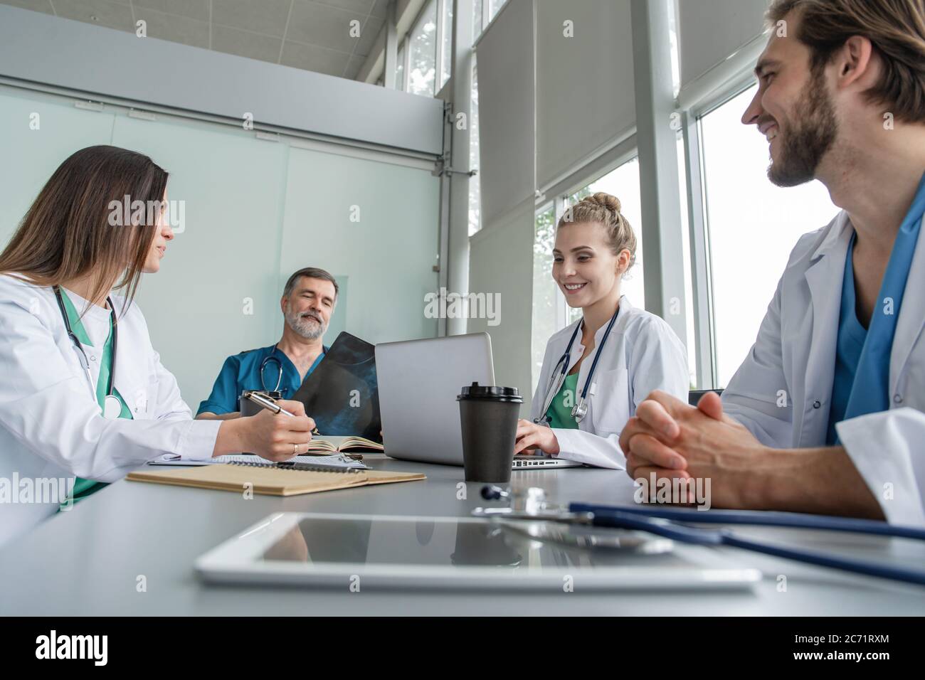 Medical Team Discussing Treatment Options With Patients. Team of ...