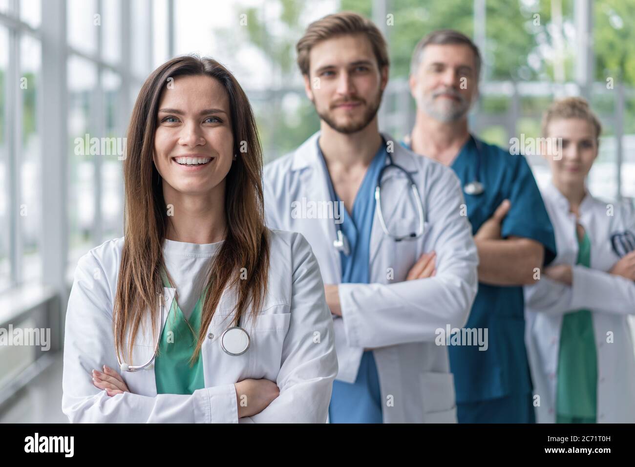 Female doctor at the hospital with her team Stock Photo - Alamy