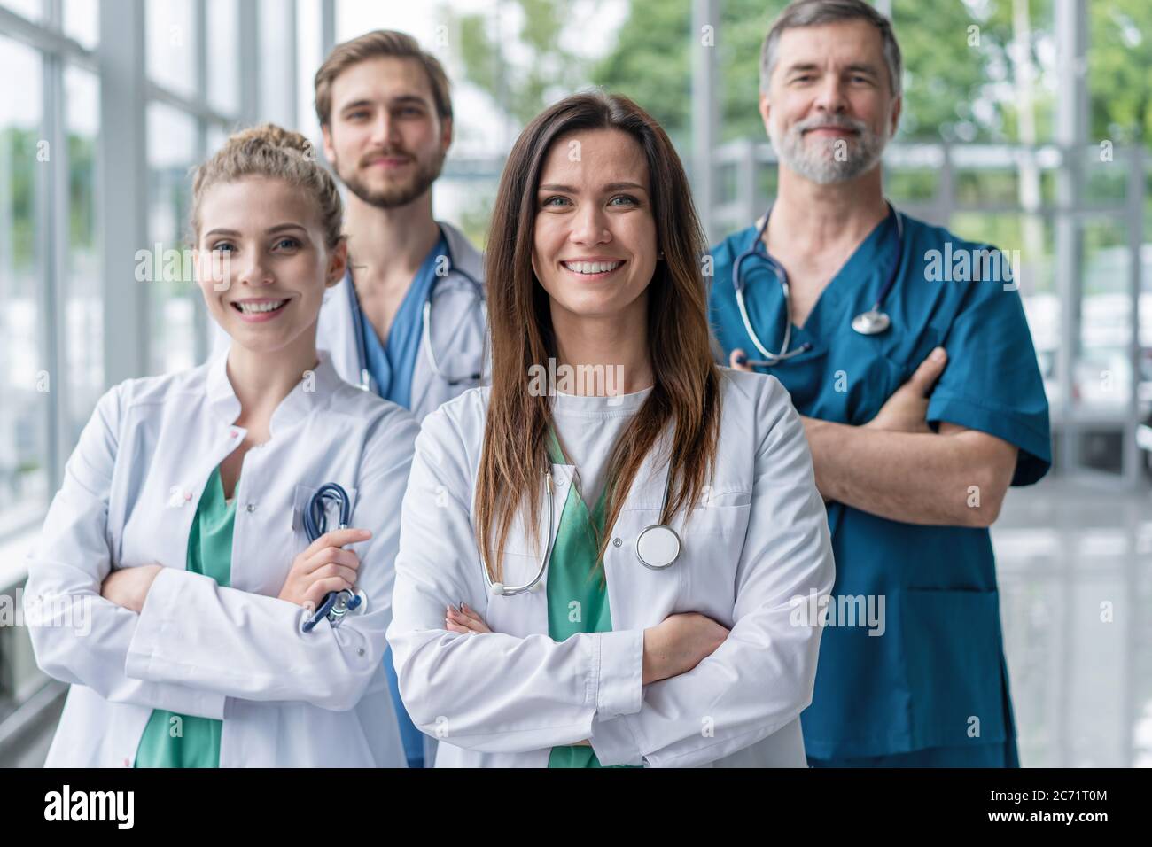 Group of medical staff smiling at the hospital Stock Photo - Alamy