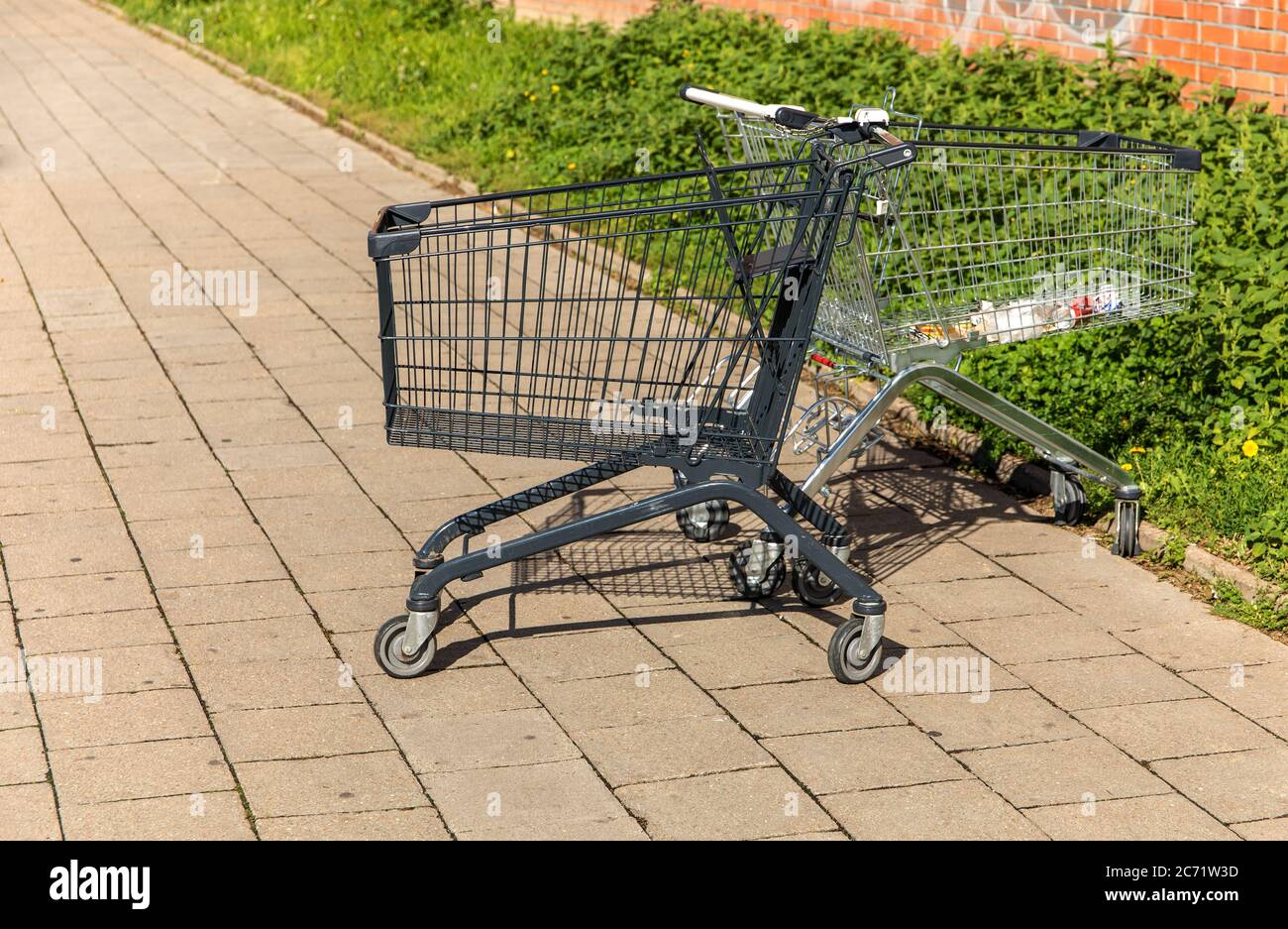 Shopping trolley on parking lot hi-res stock photography and images - Alamy