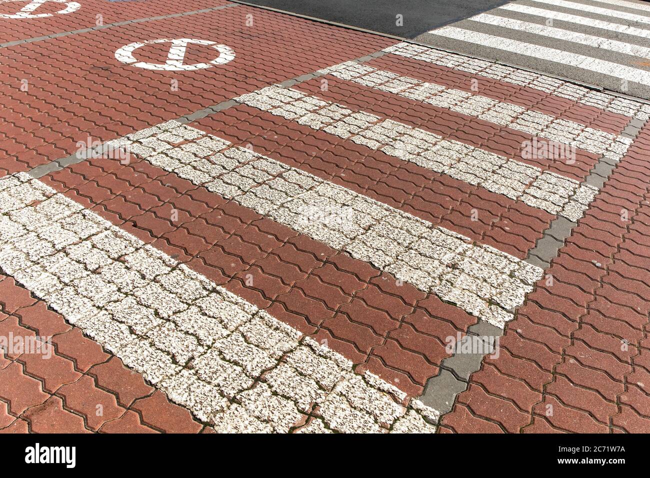Crosswalk. Red concrete paving stones. Safe road crossing. Traffic ...