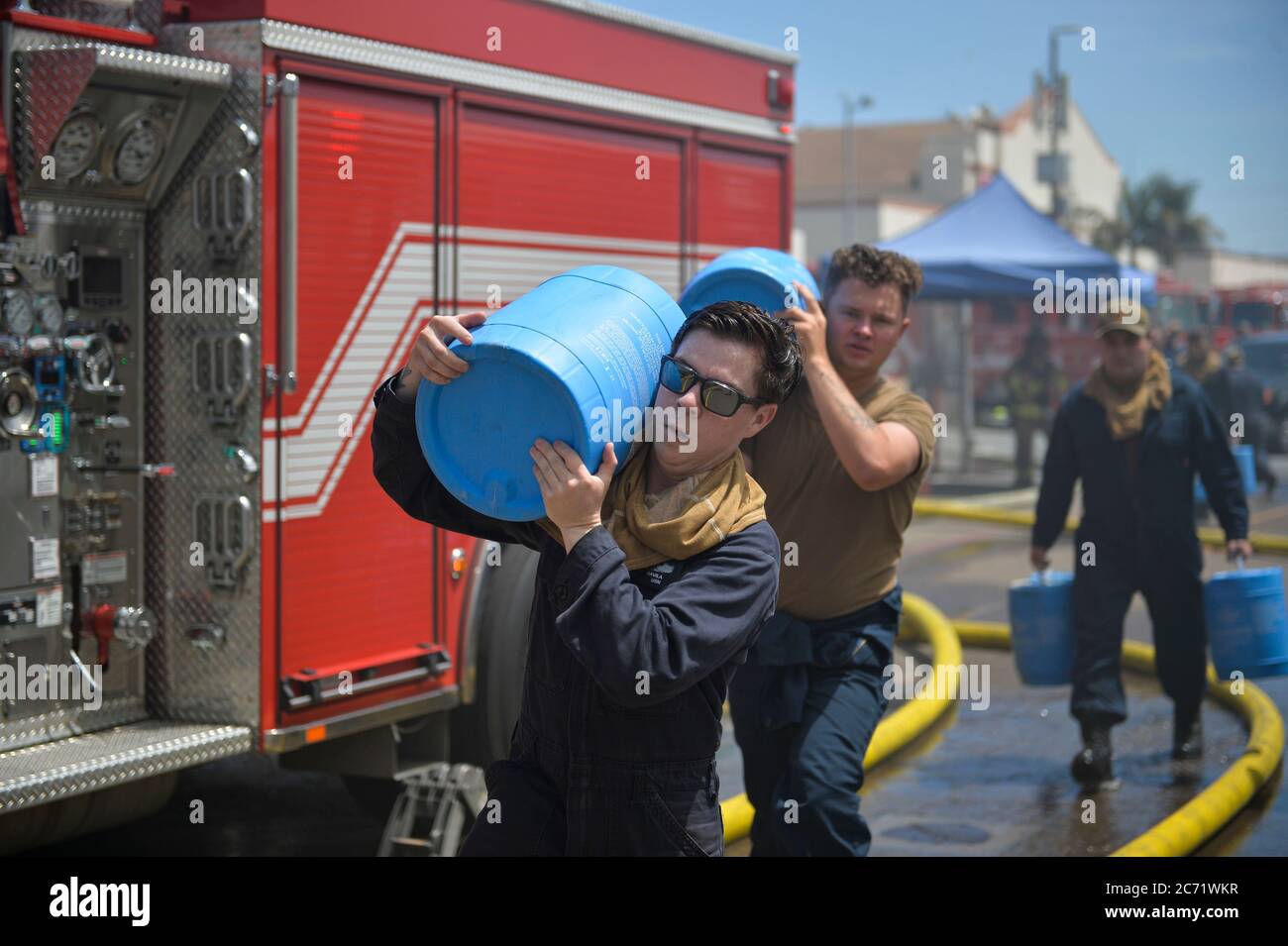San Diego, United States. 12th July, 2020. U.S. Navy fireman carry ...