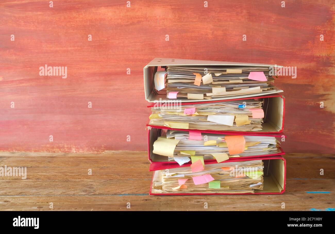 messy file folders and documents, bureaucracy and red tape concept ...