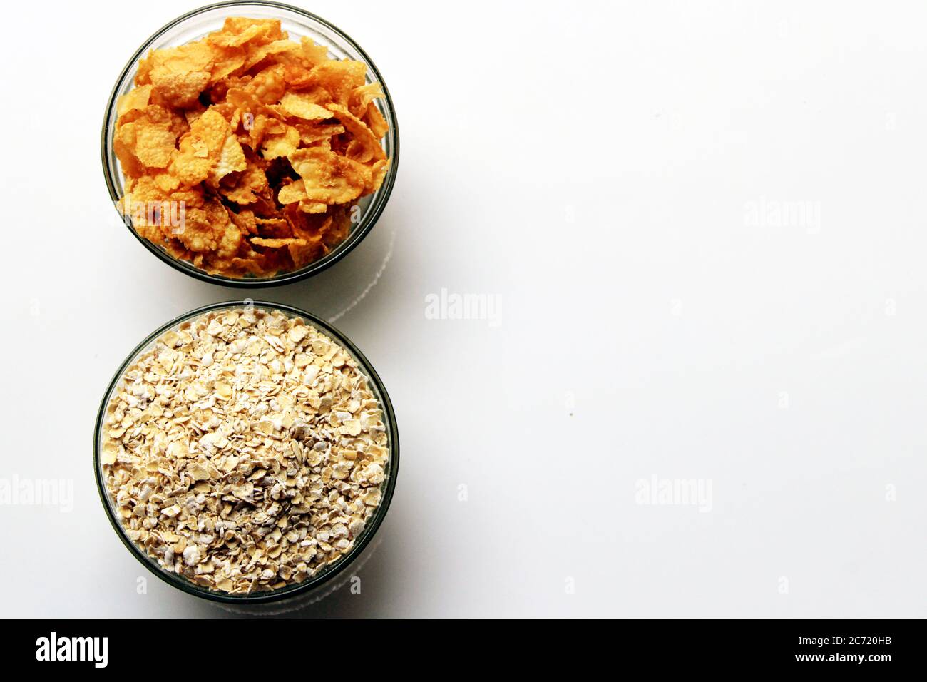 Bowl full of oats and corn flakes. Porridge oats in cereal bowl and ...
