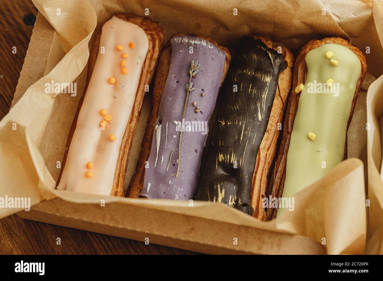 Group of colorful eclair cakes close up Stock Photo - Alamy