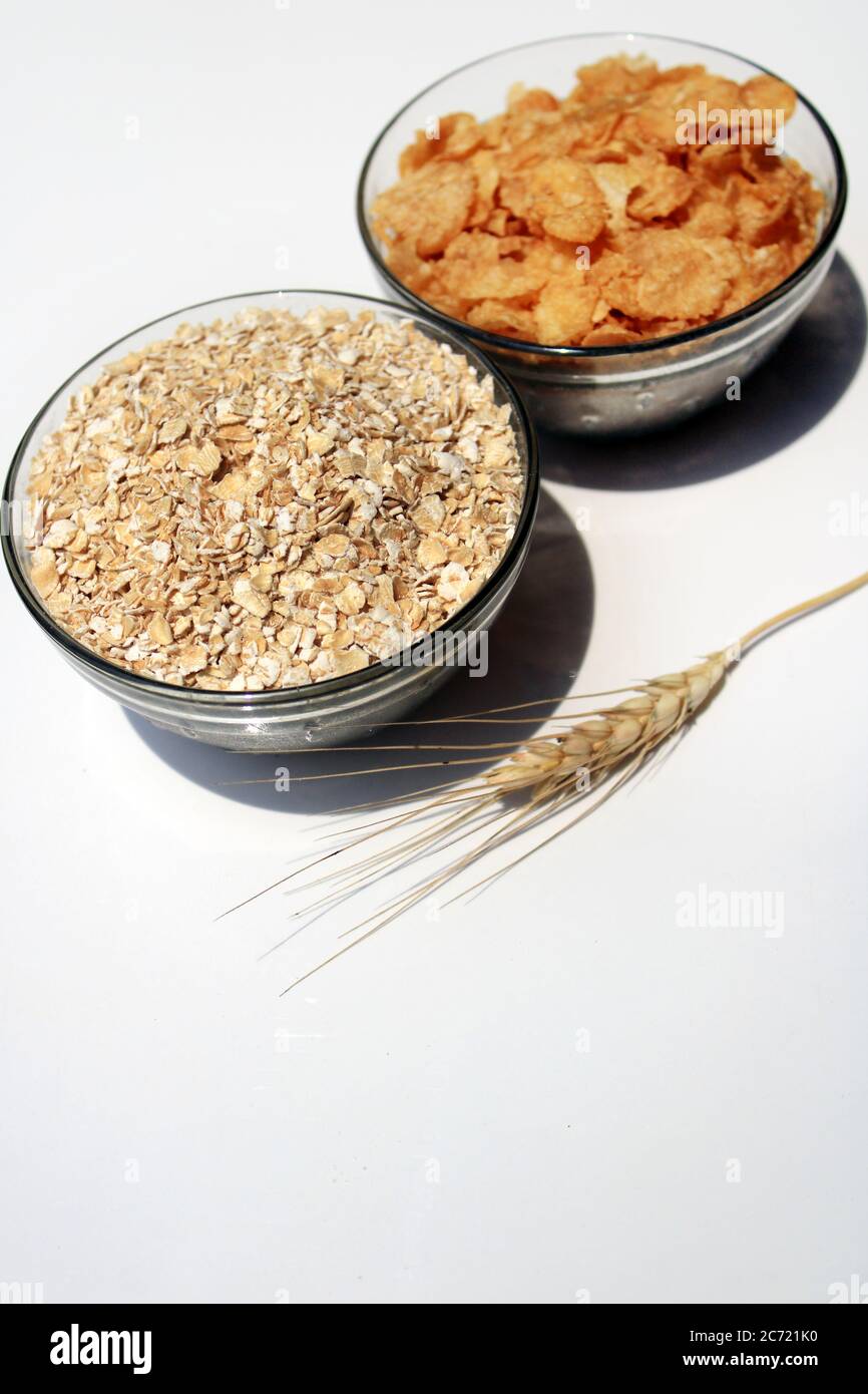 Bowl full of oats and corn flakes. Porridge oats in cereal bowl and ...