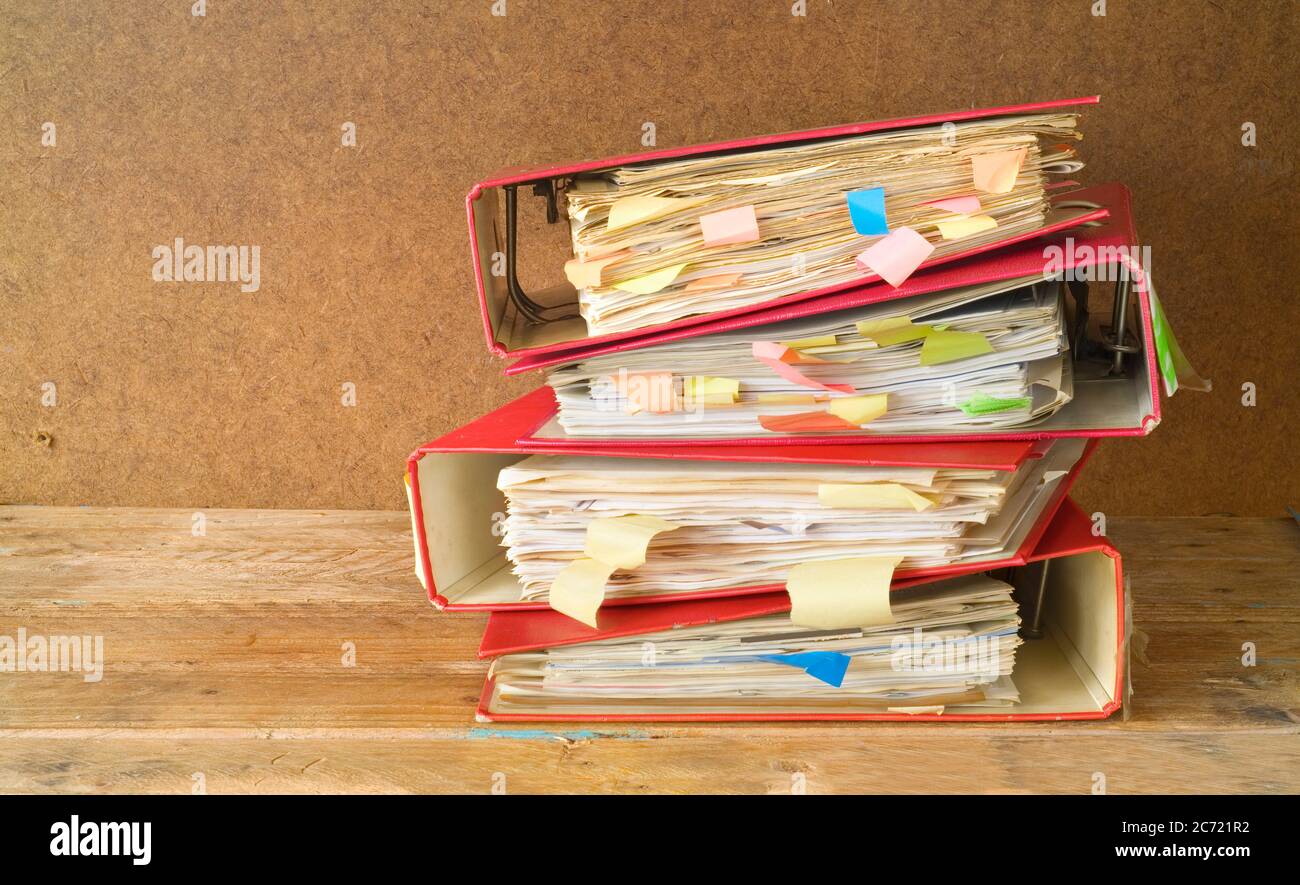 messy file folders and documents, bureaucracy and red tape concept ...