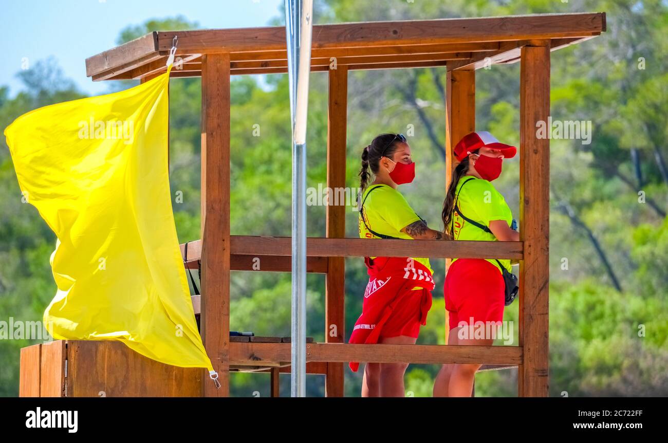Life guards, lifeguards with corona masks watch out for the swimmers at ...