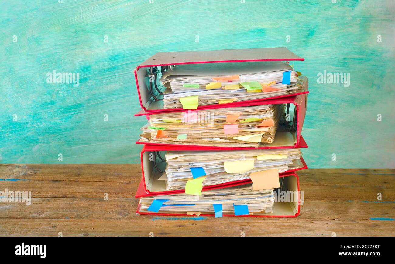 messy file folders and documents, bureaucracy and red tape concept ...