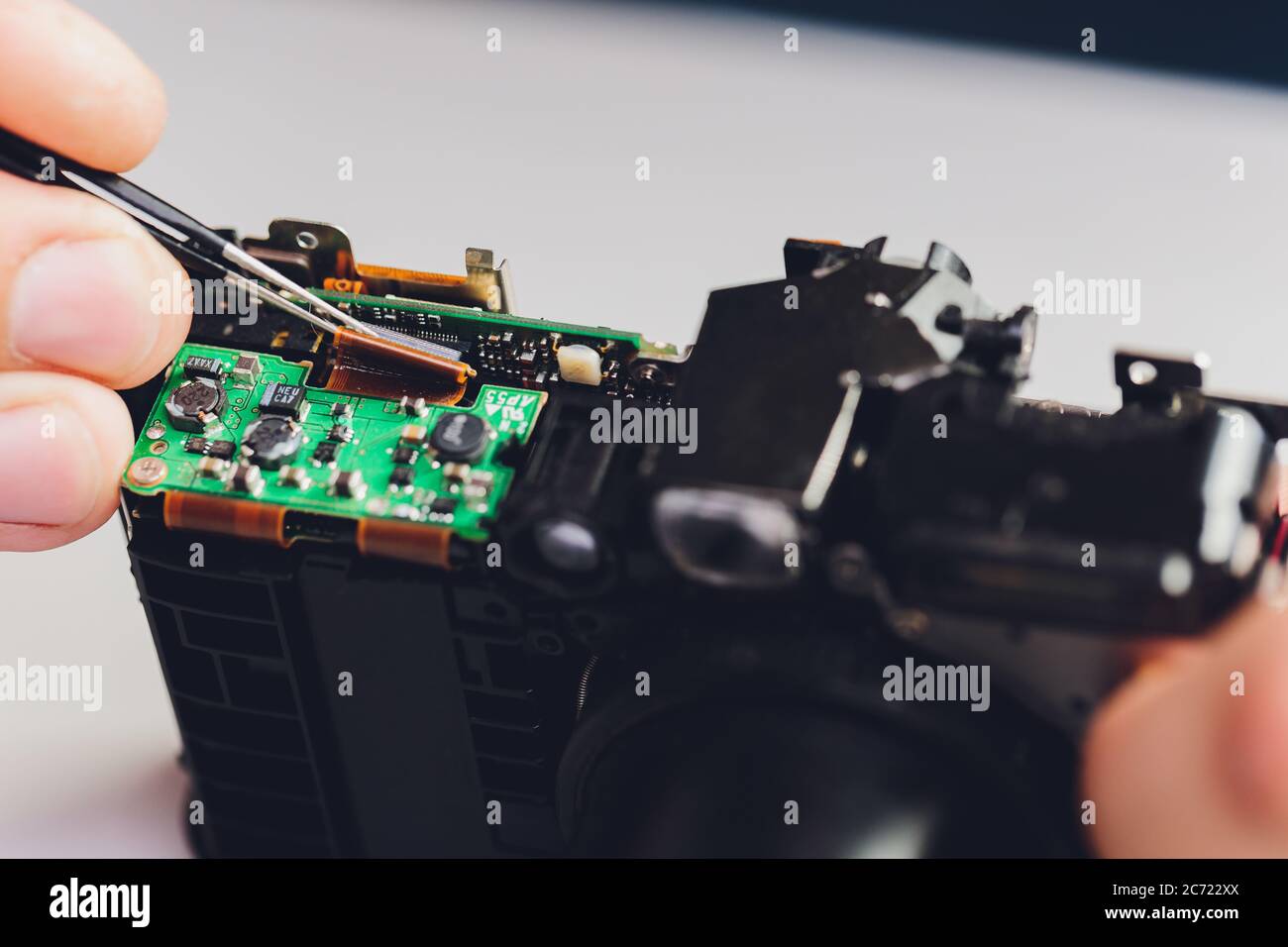 Repairing digital single lens reflex camera, isolated Stock Photo - Alamy