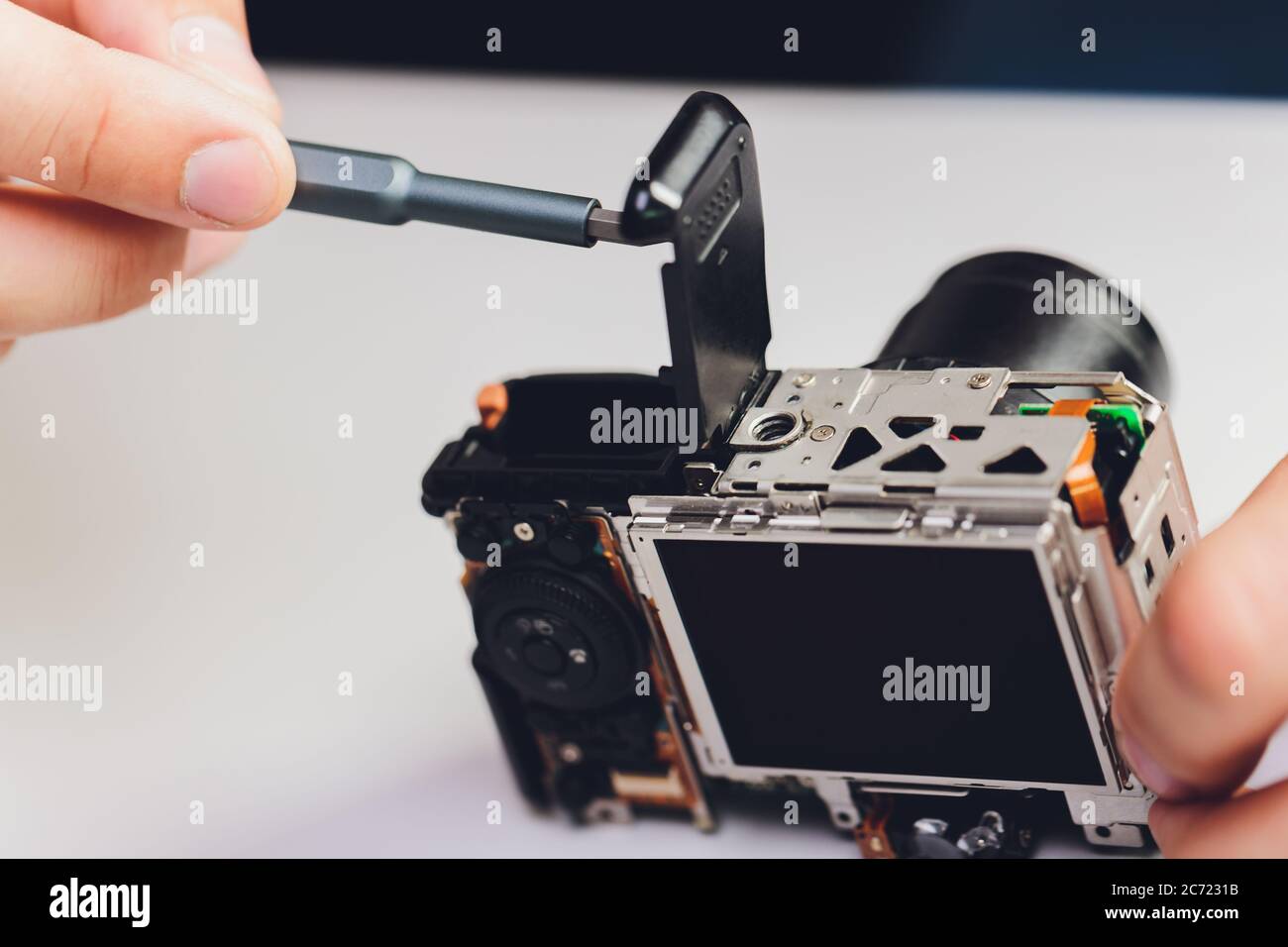 Repairing digital single lens reflex camera, isolated Stock Photo - Alamy