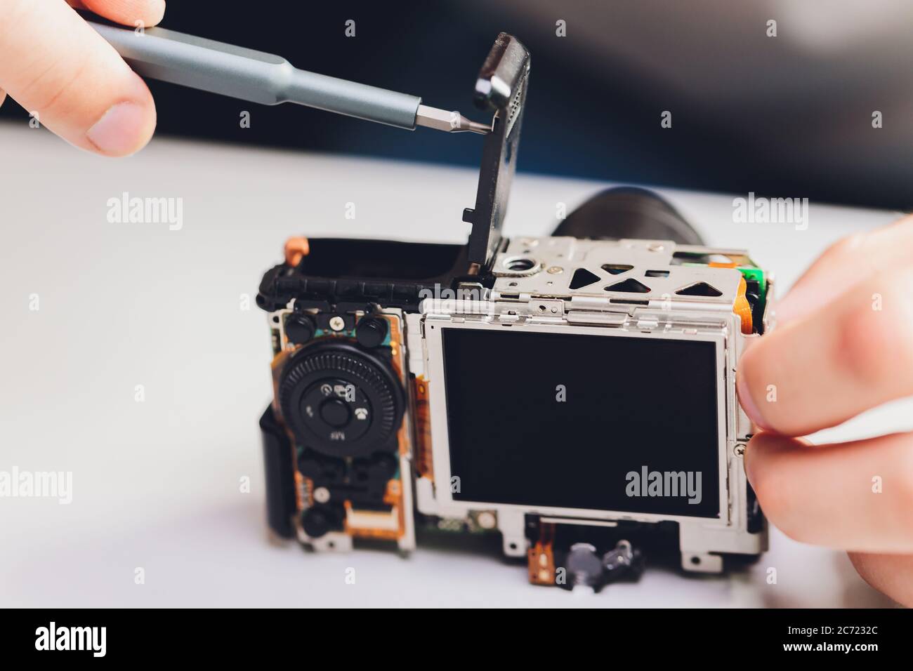 Repairing digital single lens reflex camera, isolated Stock Photo - Alamy