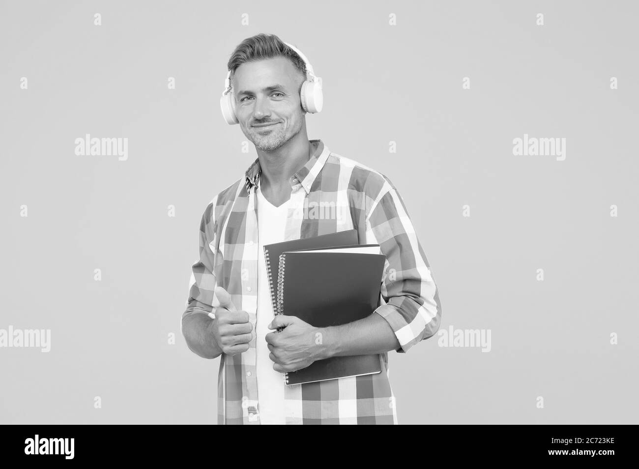 adult student hold notebook. man with folder in headphones. online ...